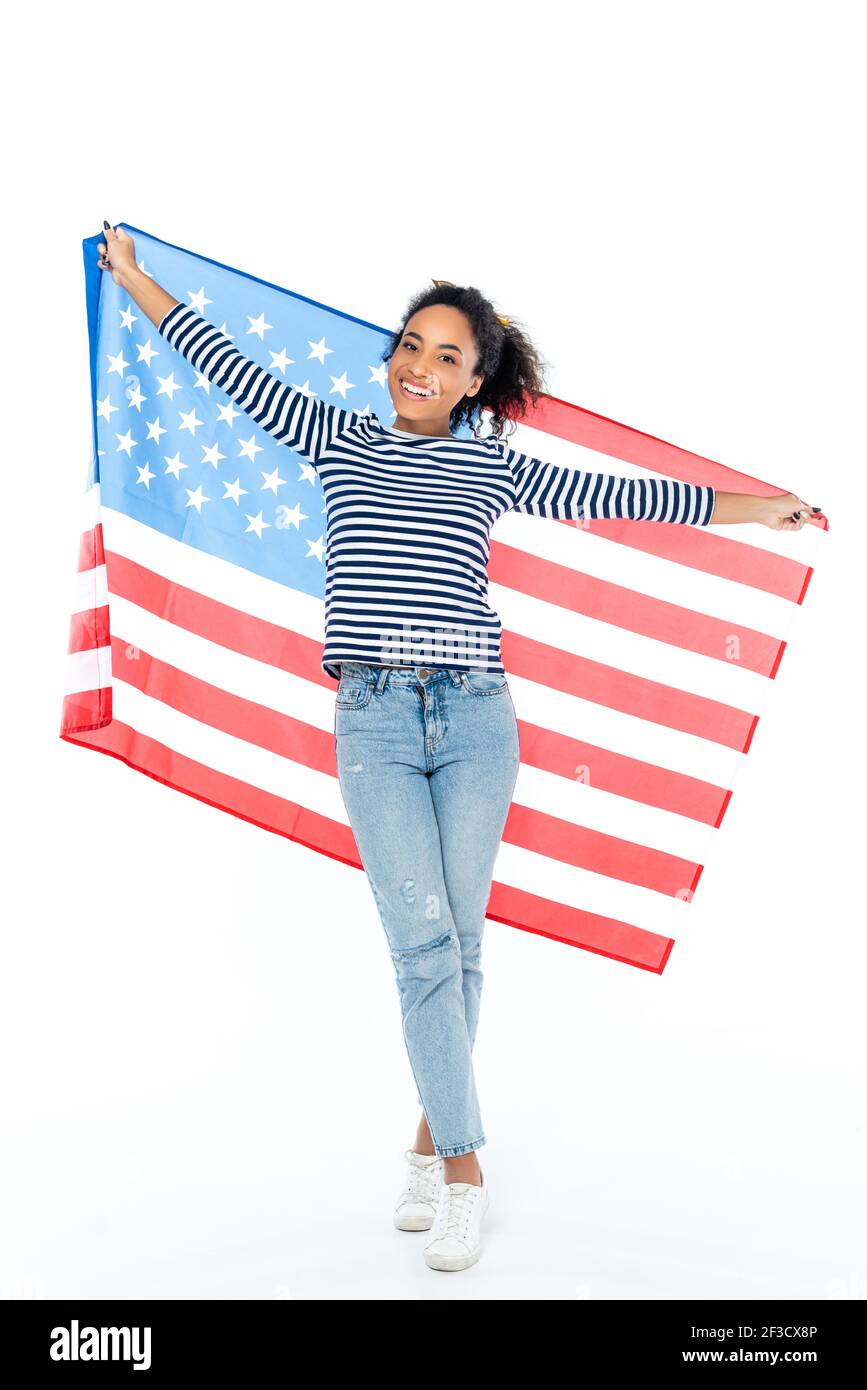 full length view of happy african american woman standing with usa flag ...