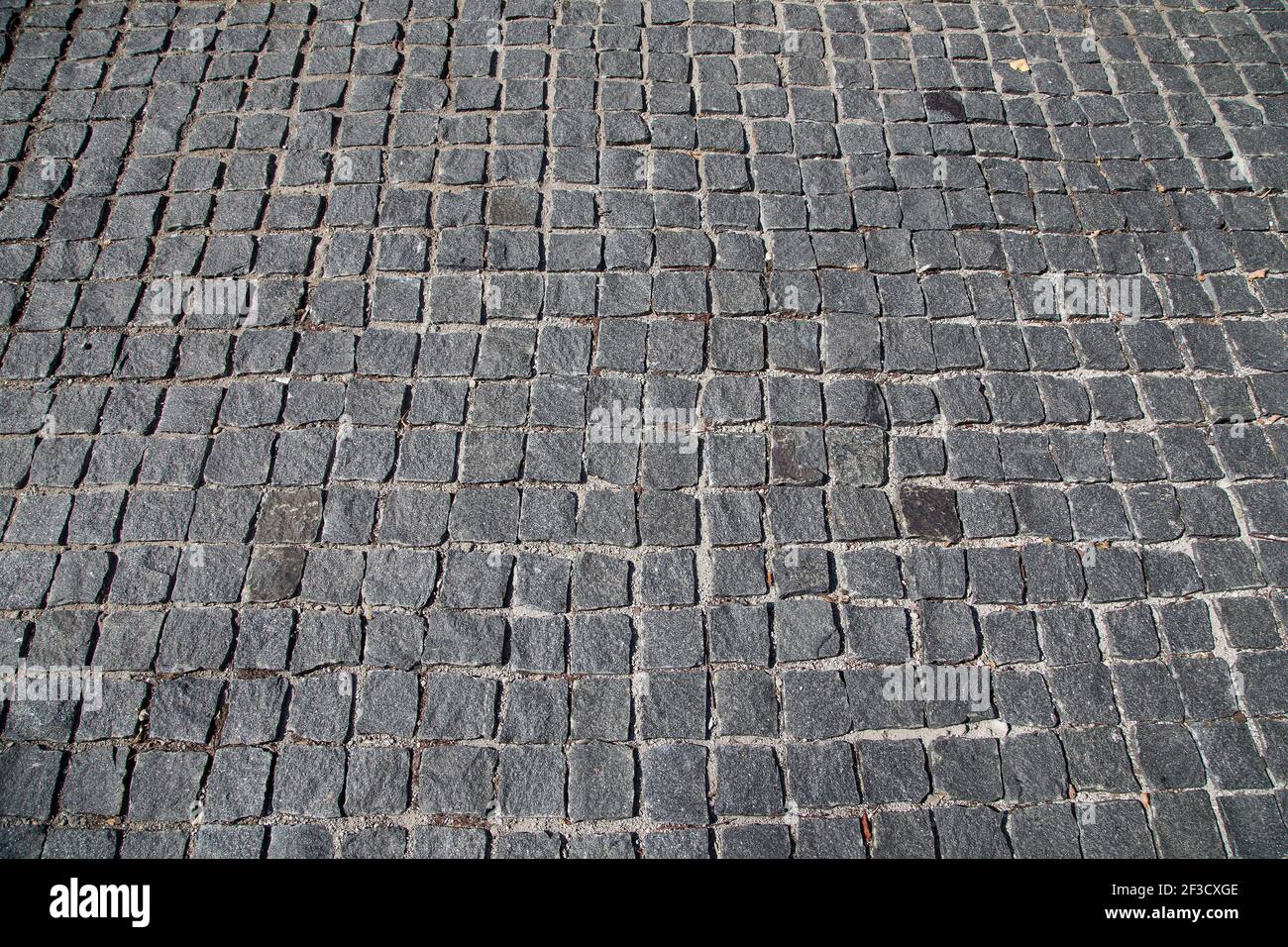 Stone pavement texture-- Granite cobblestoned pavement background. Abstract background of old ...