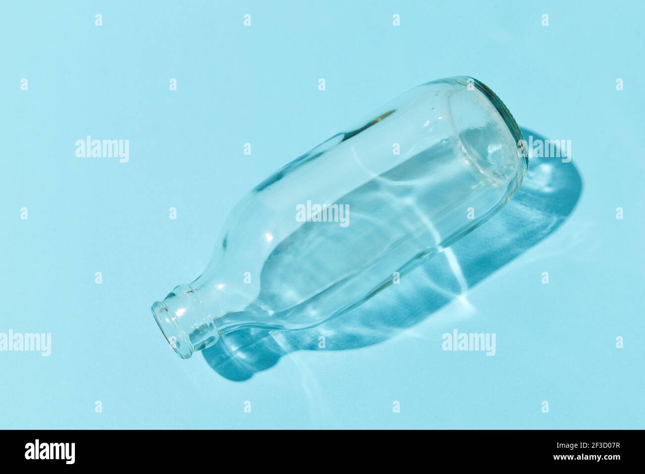 Empty class bottle on blue background. Zero waste low-waste living ...