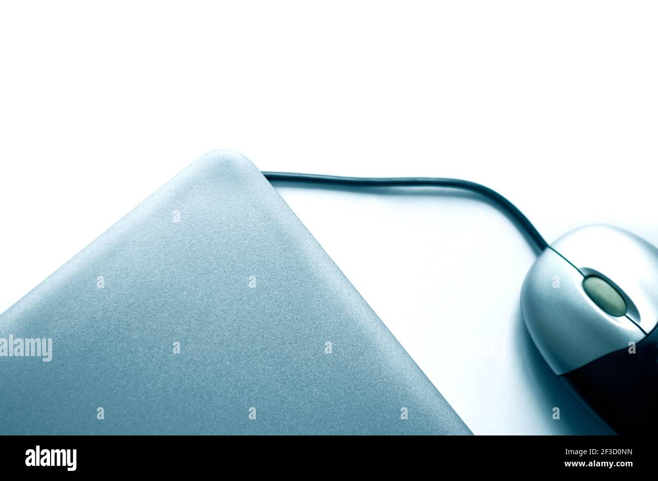 Diagonal View of Blue Toned Laptop and Mouse on White Background ...