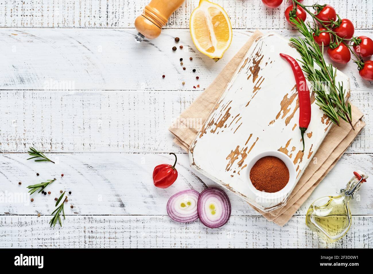 Cooking Background with spices: pepper, rosemary, paprika, lemon, onion ...