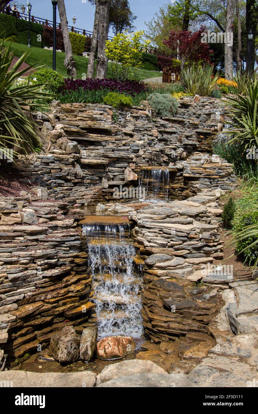 Small rocky waterfall pouring into a small pool Stock Photo - Alamy