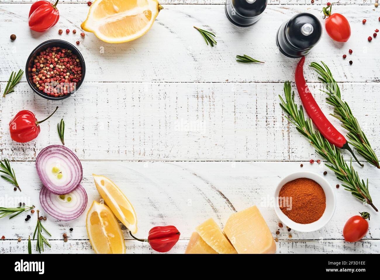 Cooking Background with spices: pepper, rosemary, paprika, lemon, onion ...