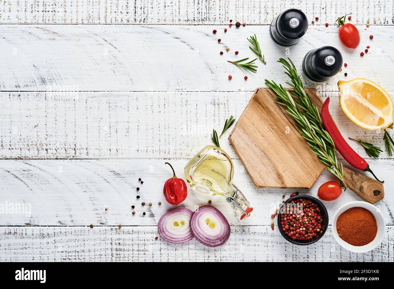 Cooking Background with spices: pepper, rosemary, paprika, lemon, onion ...