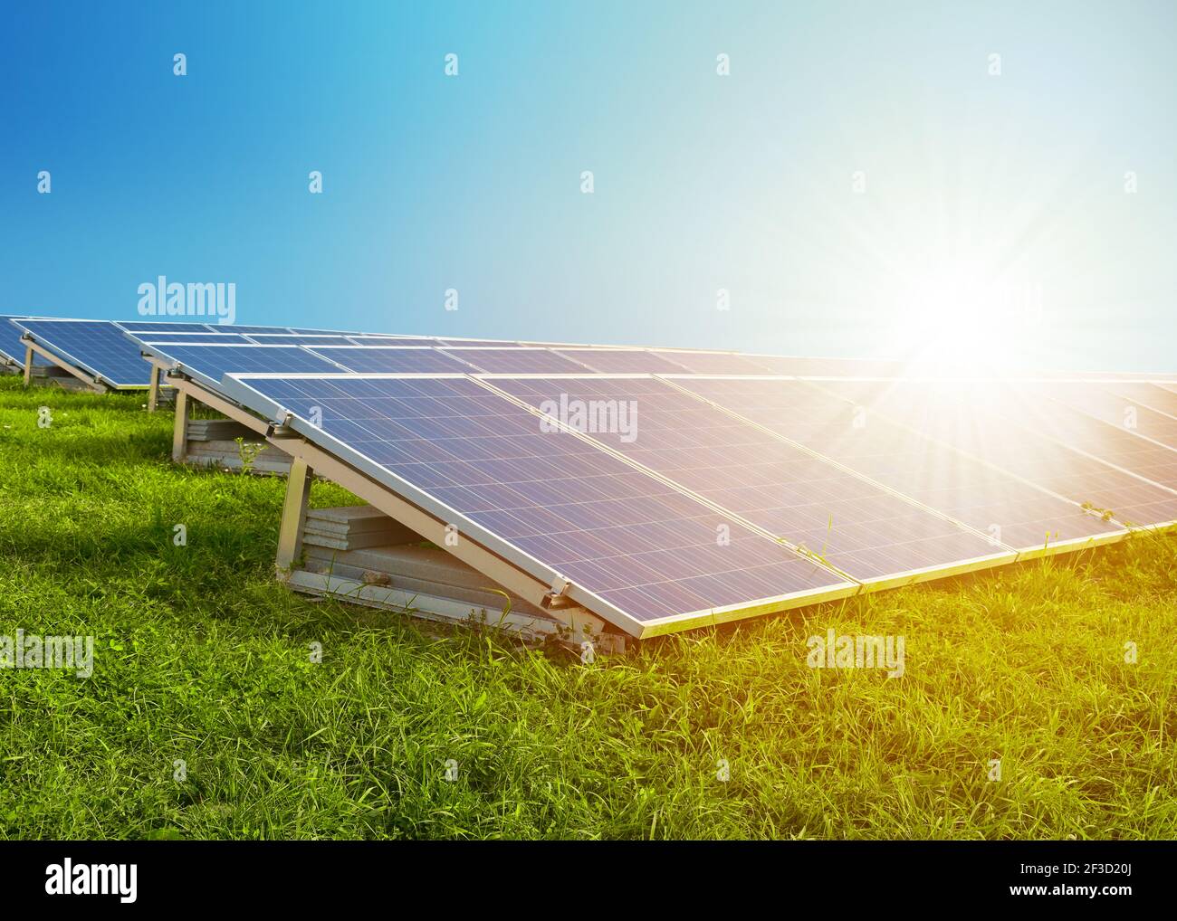 Solar panels on grass in the sun Stock Photo - Alamy