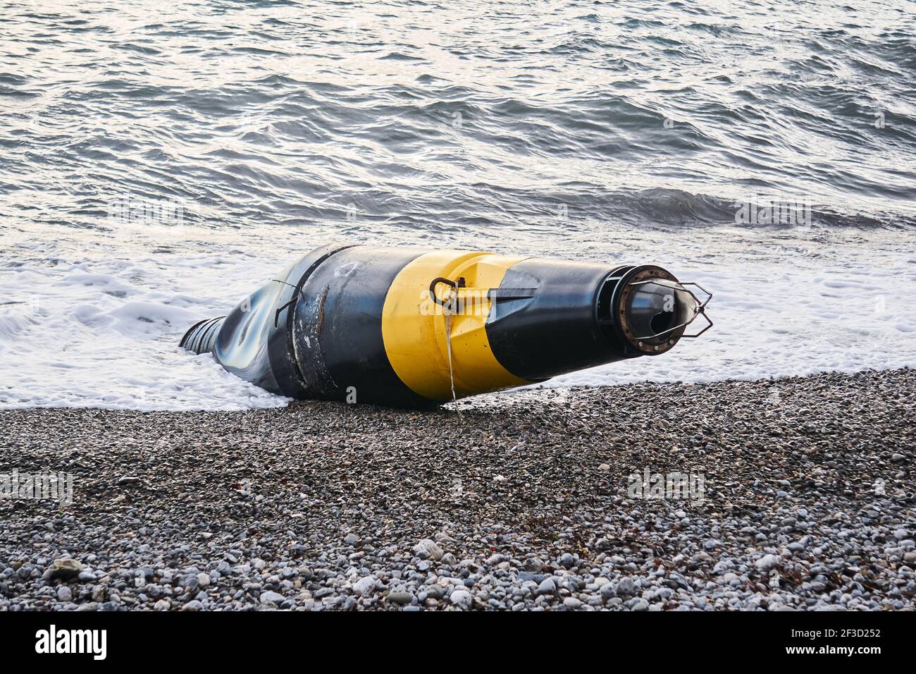 damaged sea buoy washed ashore after a storm Stock Photo - Alamy