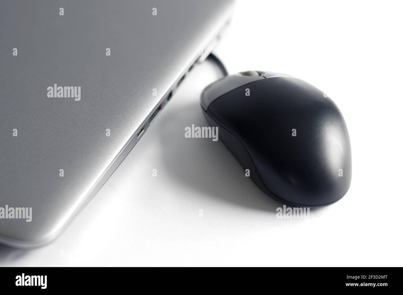 Close View of Silver Laptop and Black Mouse with White Background ...
