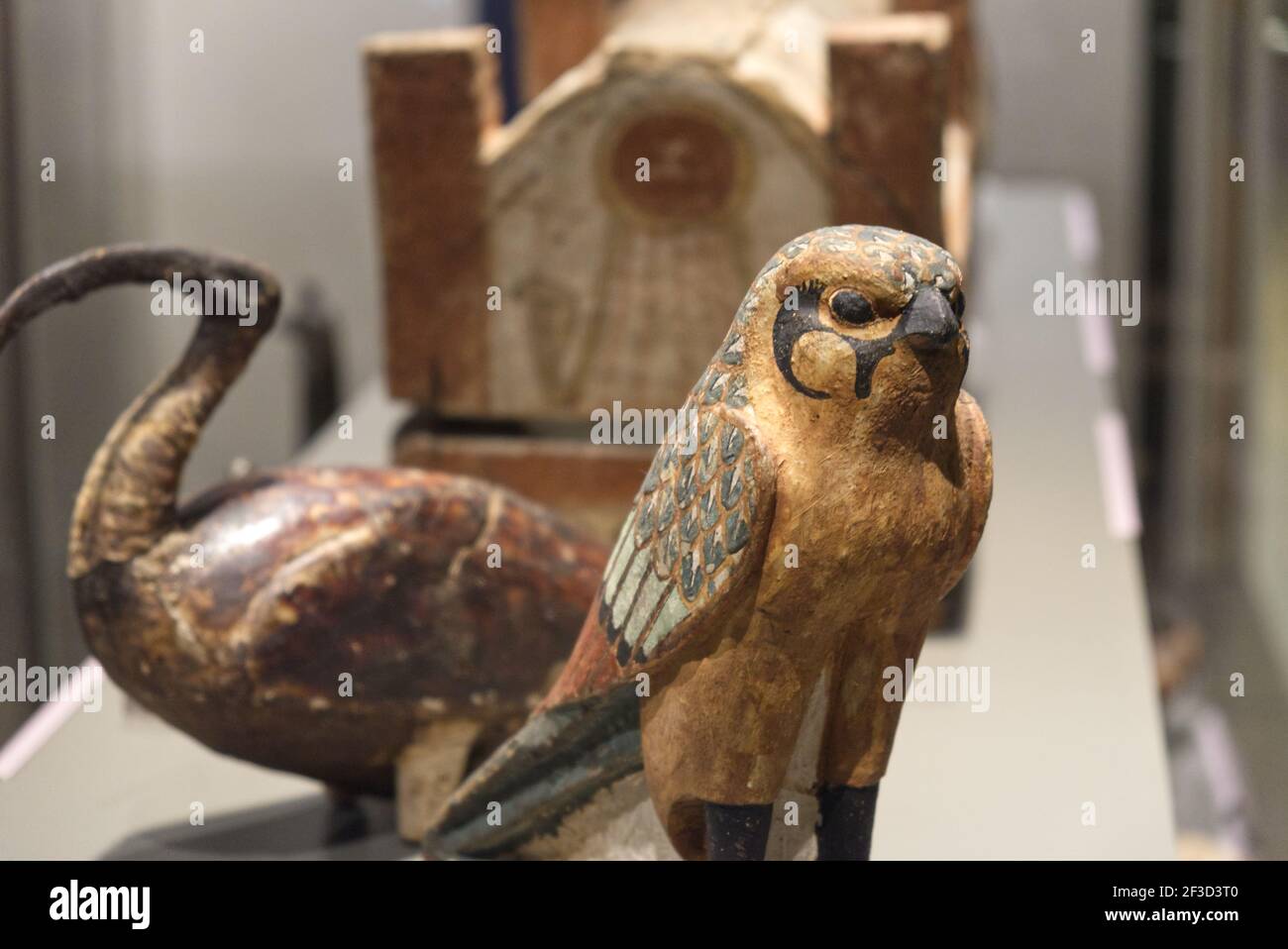 Egyptian wooden statues depicting the gods of the ibis and falcon ...