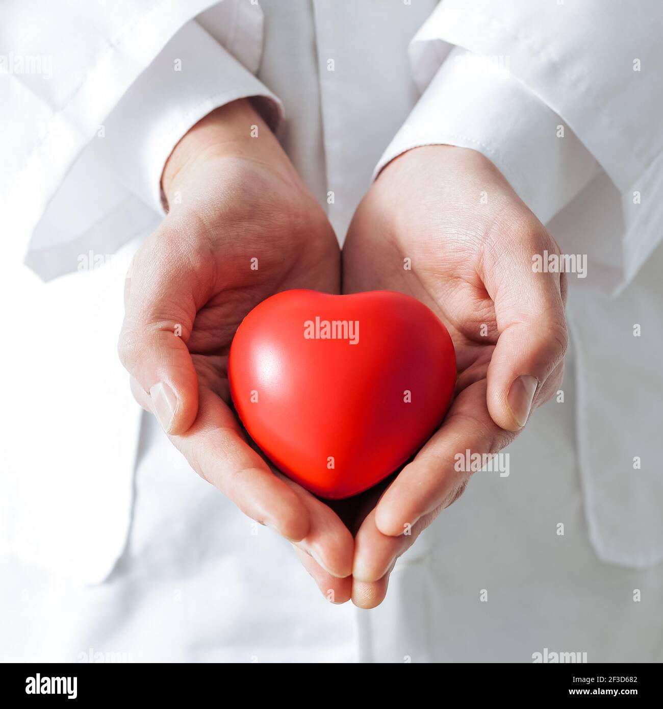 heart symbol is in the doctor s hands Stock Photo - Alamy