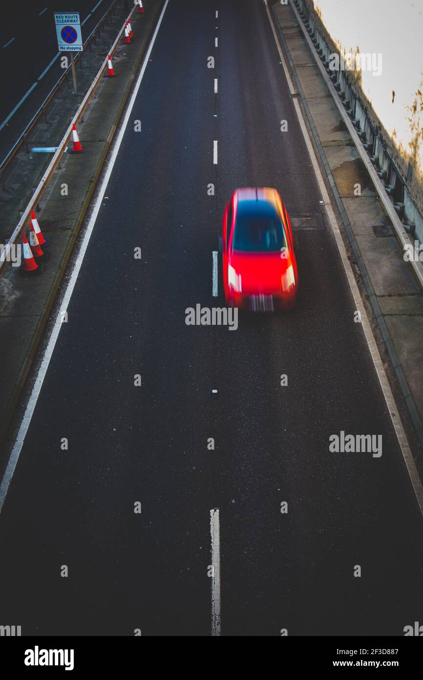 Red car speeding down the motorway view from above Stock Photo - Alamy