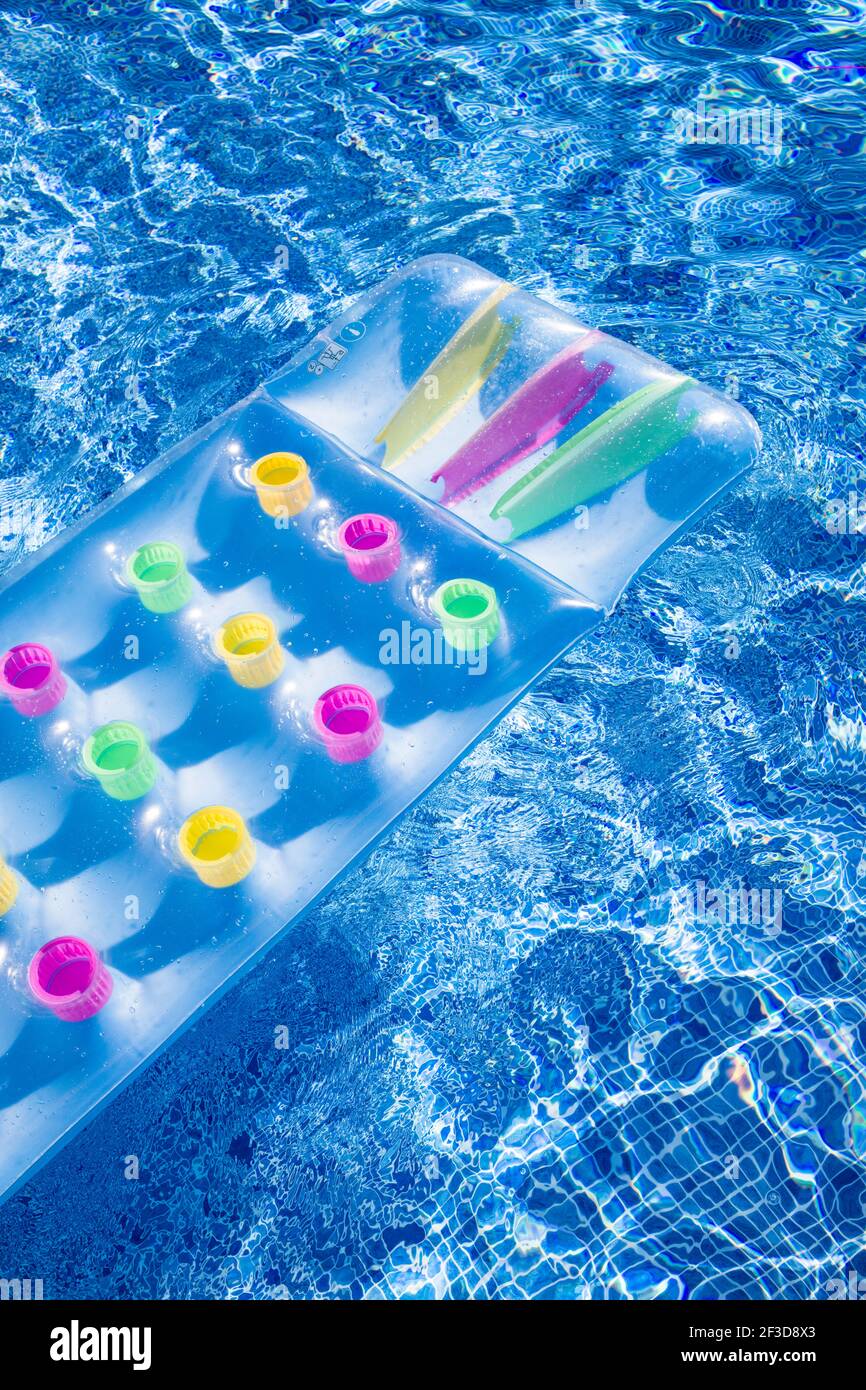 Close-up of swimming pool with floating mattress Stock Photo - Alamy