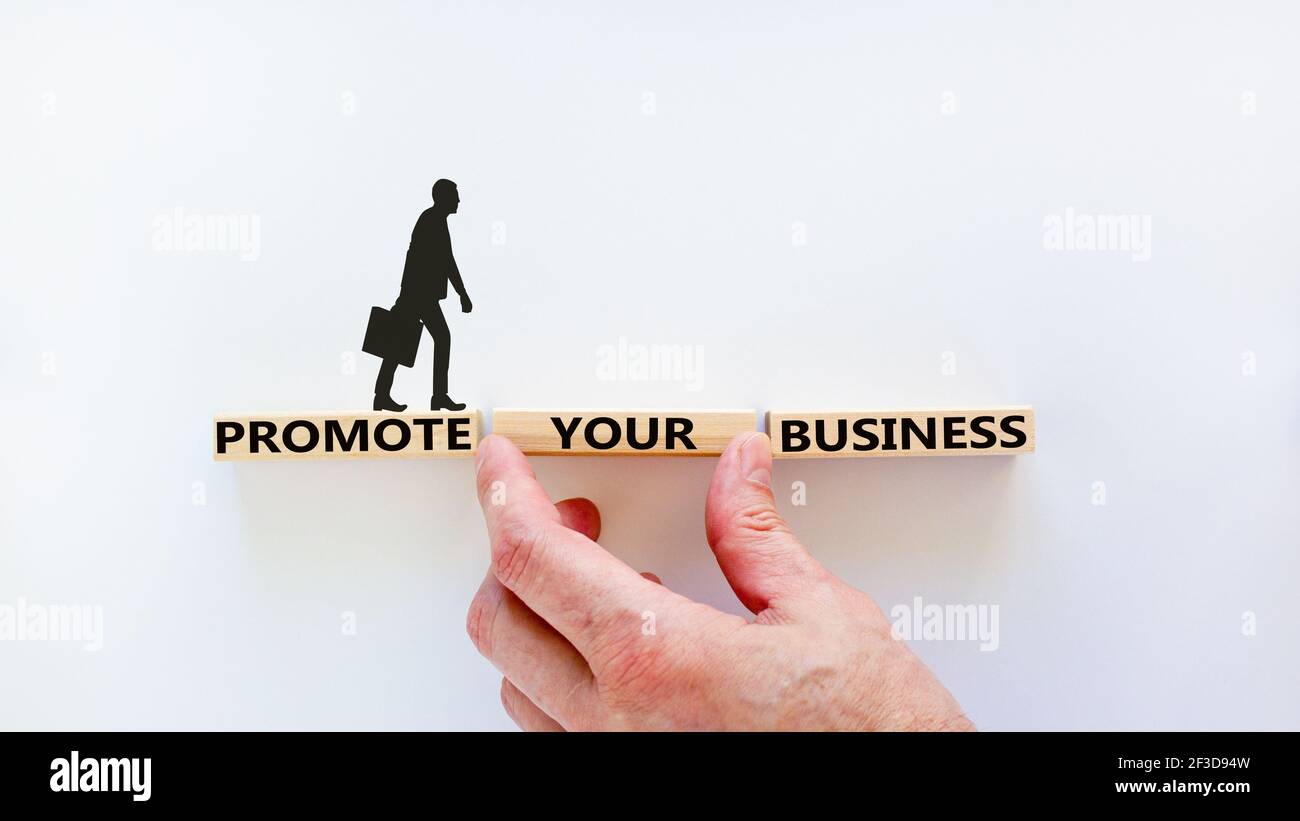 Promote your business symbol. Wooden blocks with words 'Promote your ...
