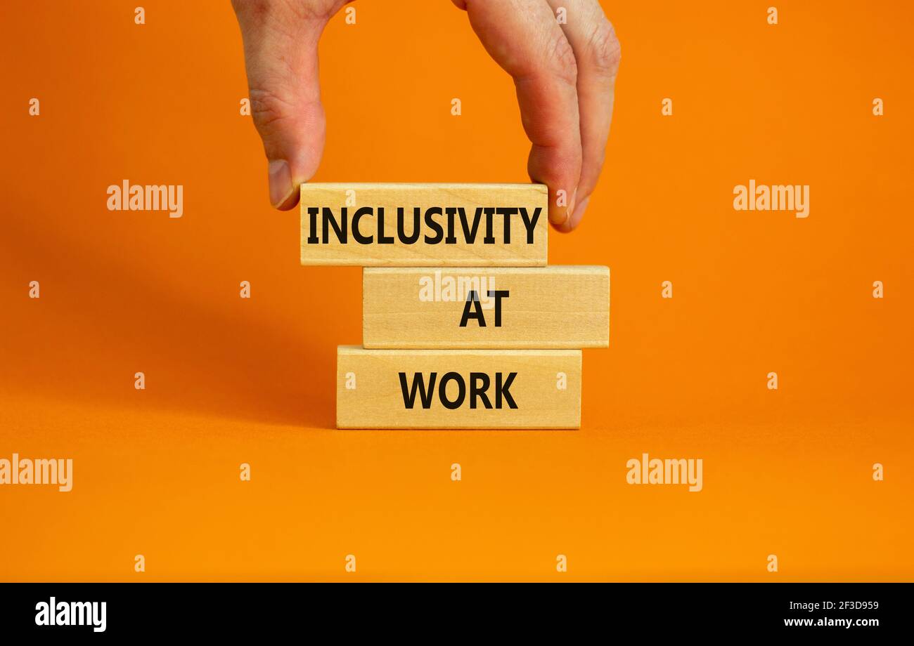 Inclusivity at work symbol. Wooden blocks with words 'Inclusivity at ...