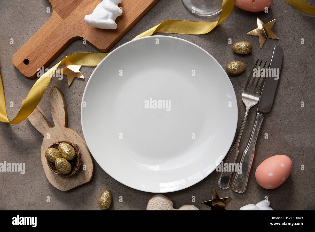 Traditional easter spring meal background. Table setting with bunny and ...
