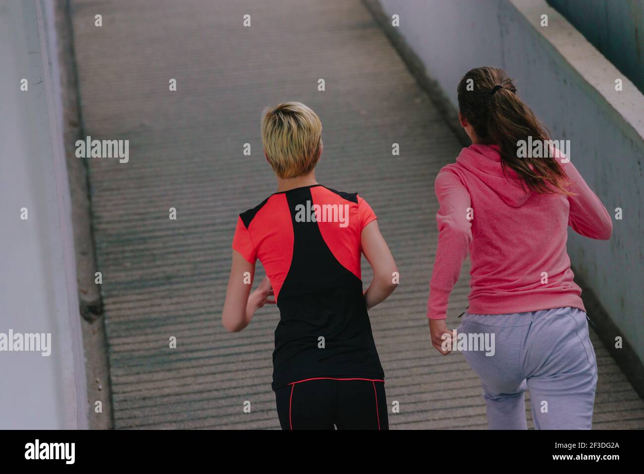 Healthy lifestyle athletes dressed in training clothes exercising Stock ...