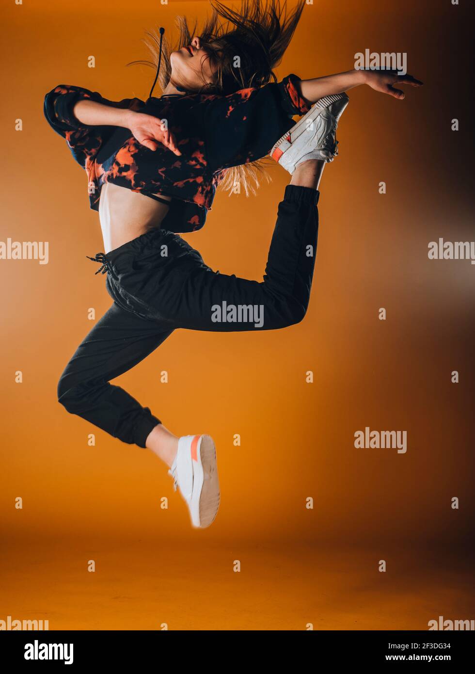Dance moves performed by an acrobatic flexible female dancer Stock ...