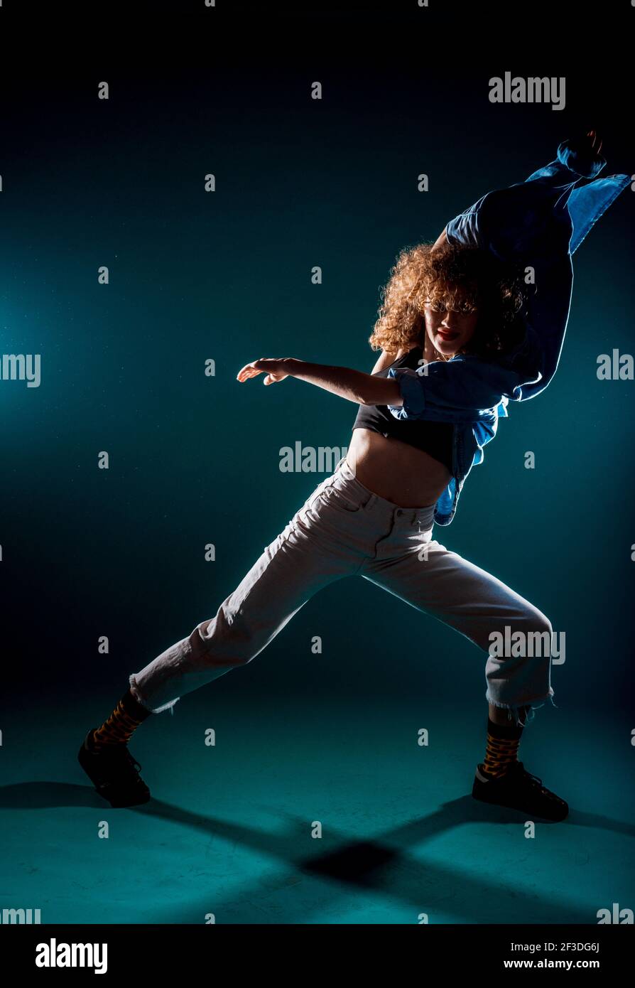 Young athletic girl performing contemporary dance moves Stock Photo - Alamy