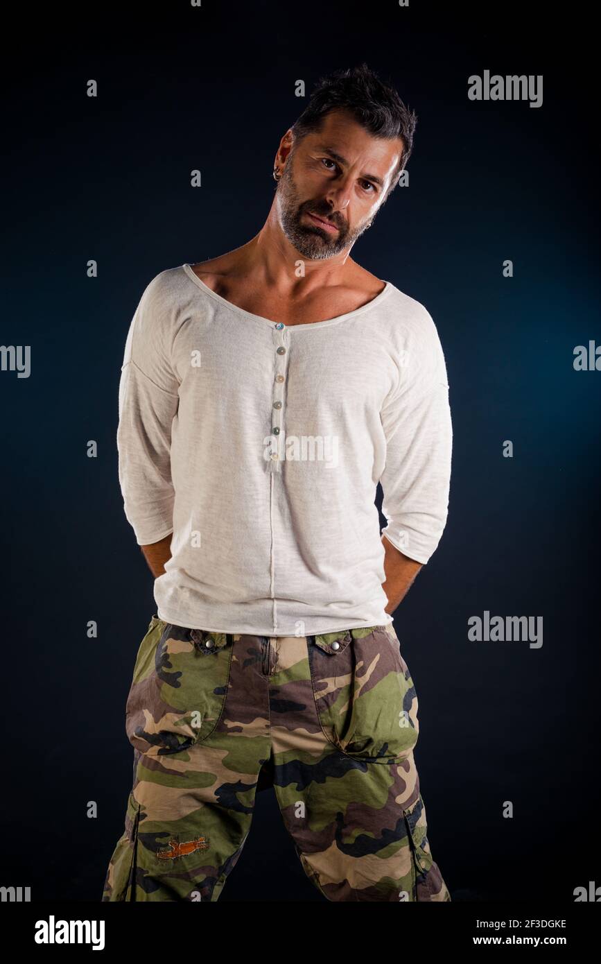 Studio body shot of a trendy young man wearing modern style clothes ...