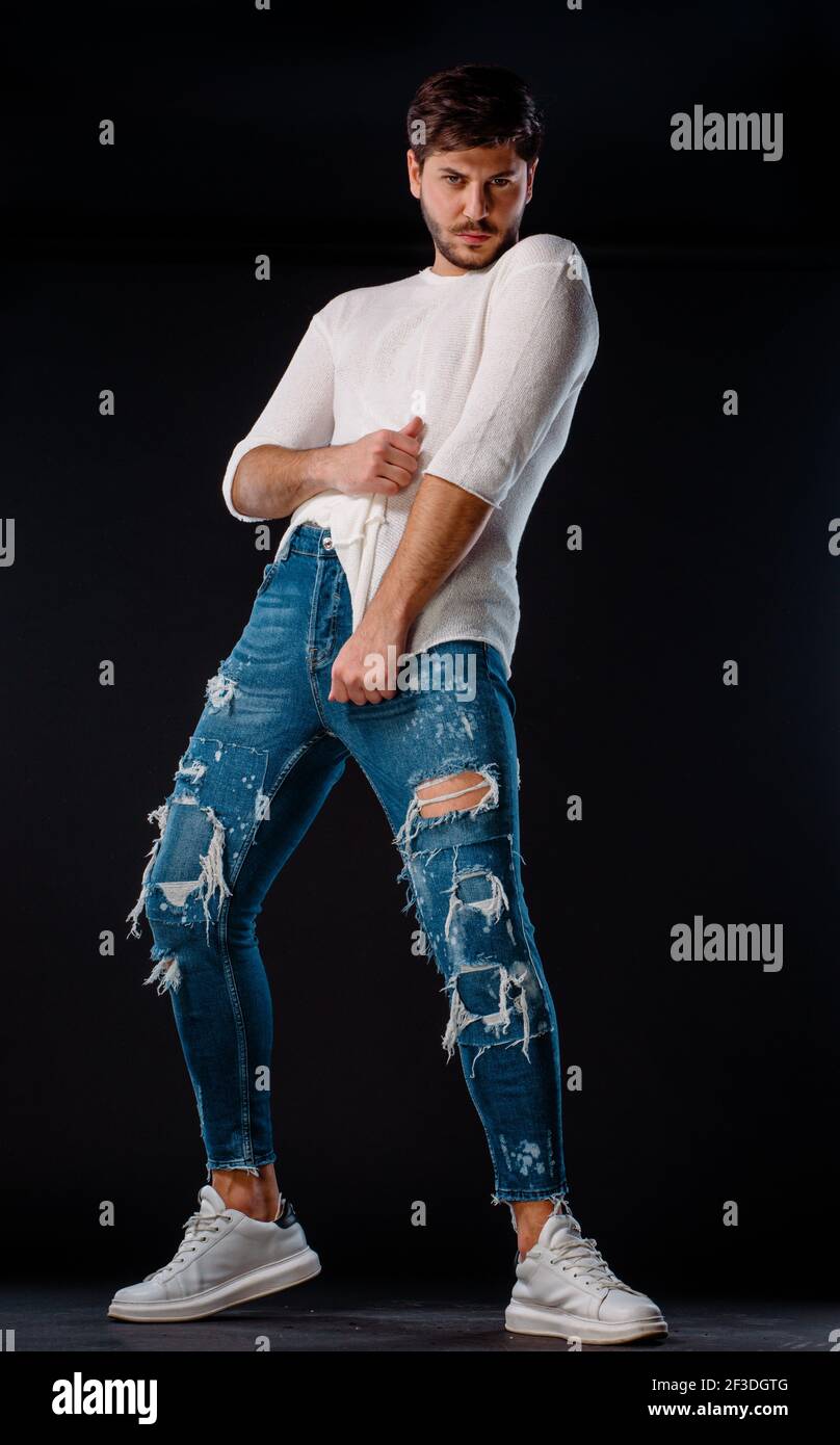 Portrait of a handsome male model posing in cool fashionable clothing ...