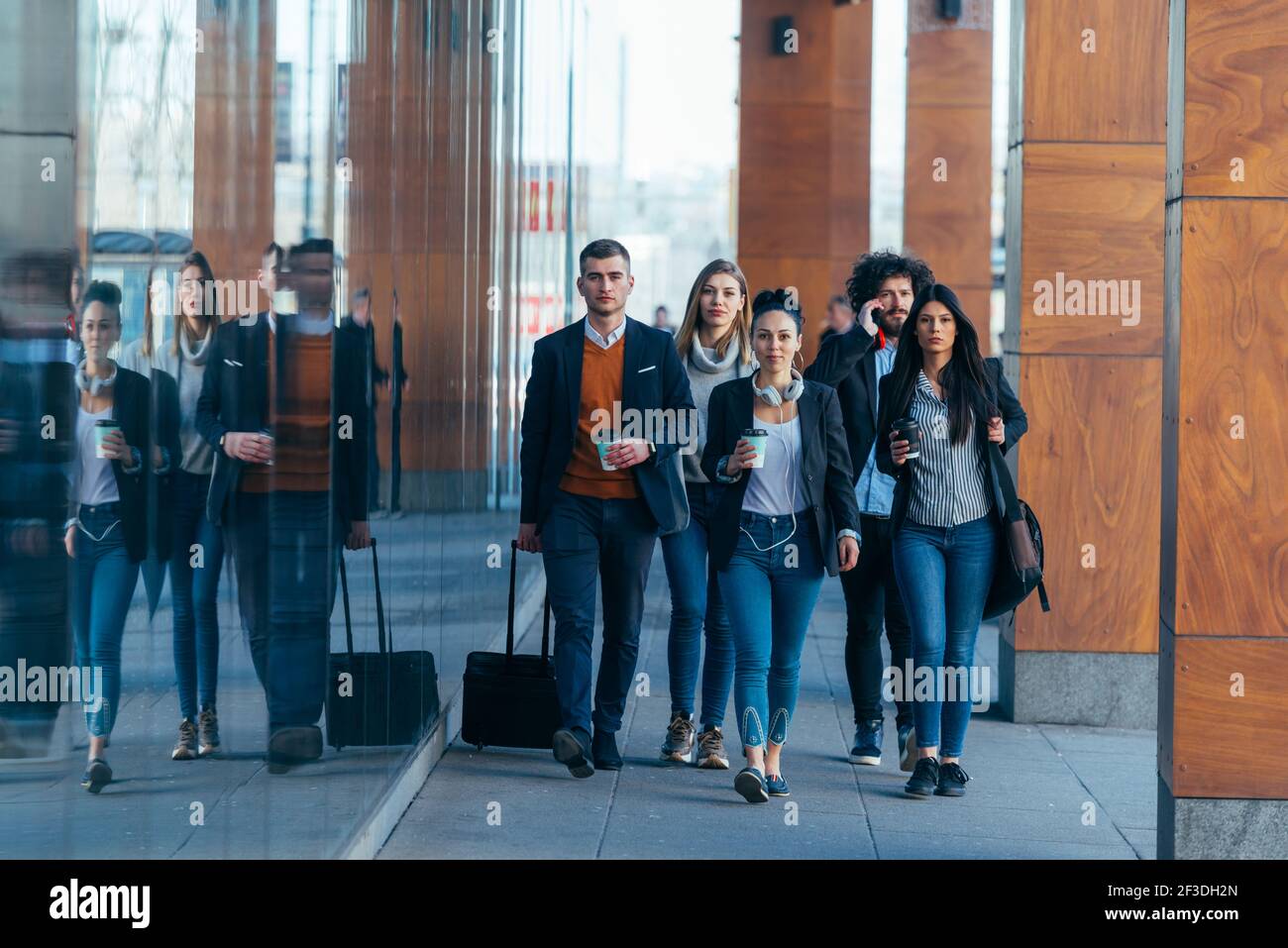 Group of colleagues on a business trip (euro trip) walking together at ...