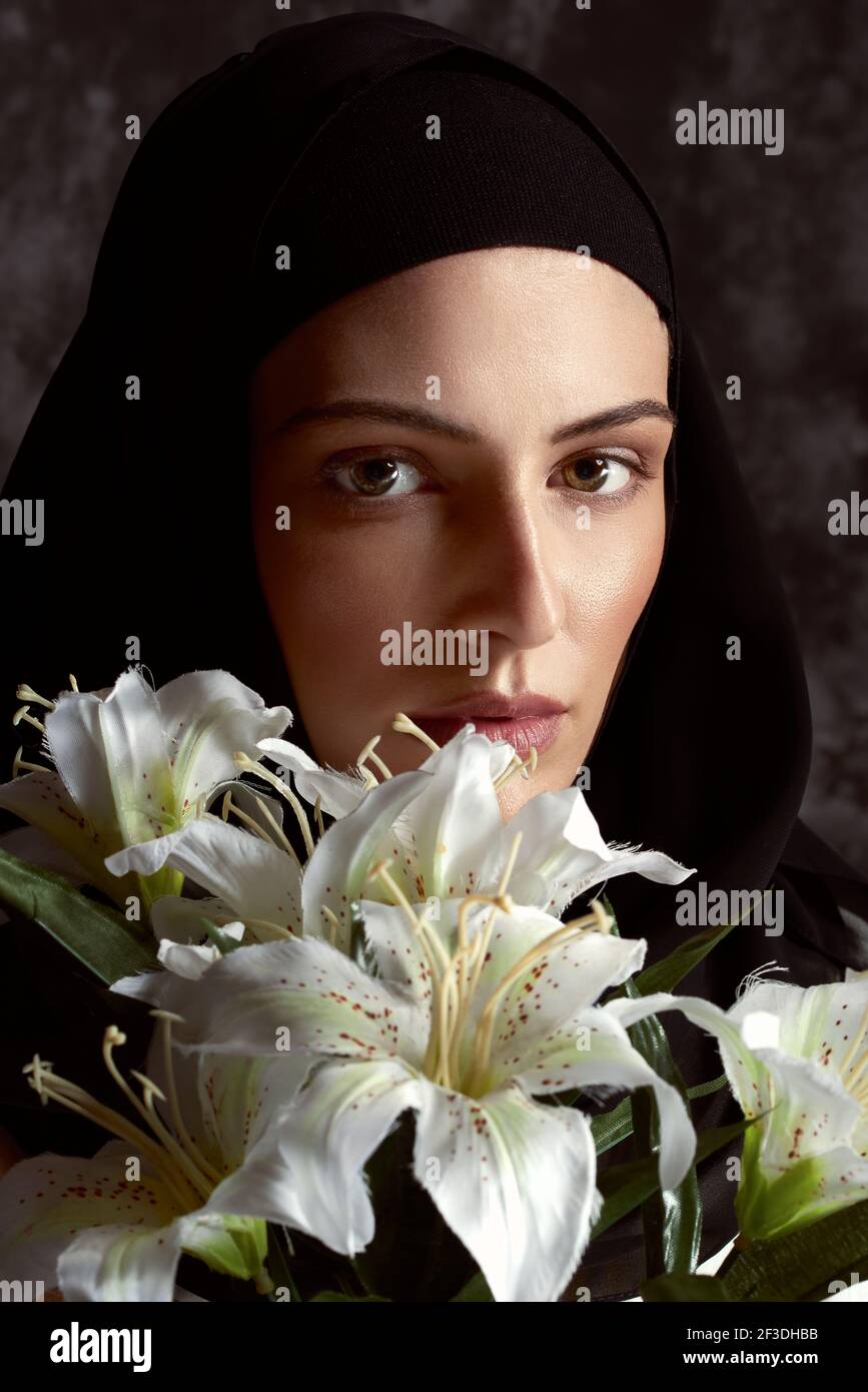 Artistic studio portrait with red roses of the ecstasy of a ...