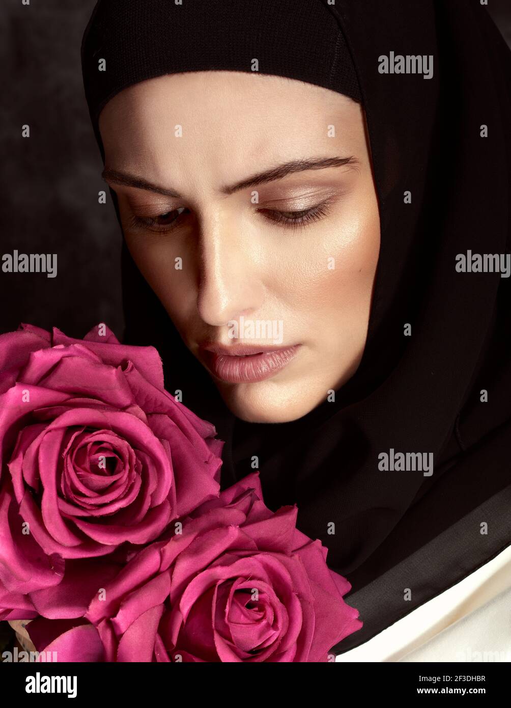 Artistic studio portrait with red roses of the ecstasy of a ...