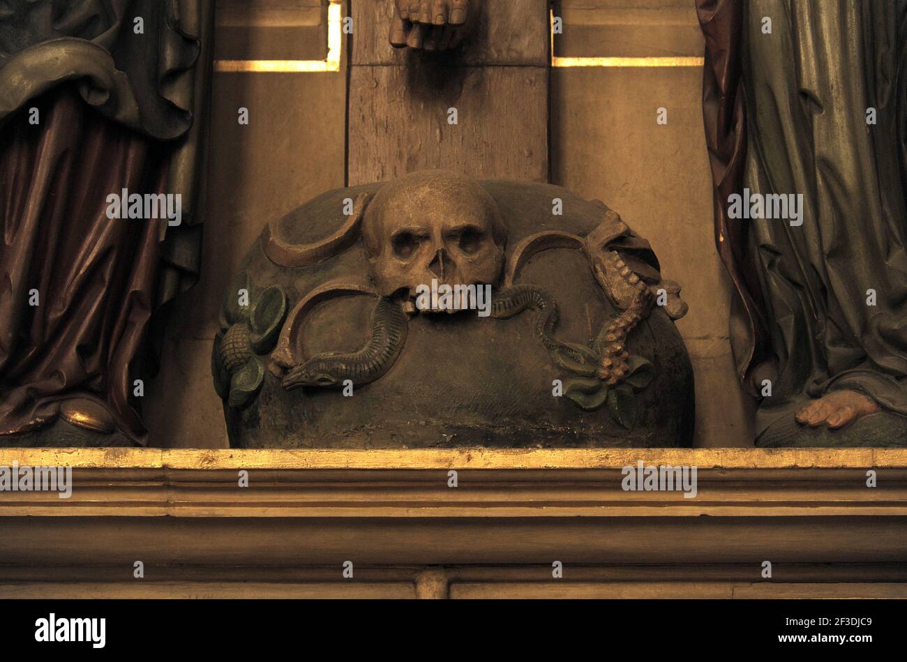 Sculpture of a skull and bones at the base of a crucifix, St Lamberts ...