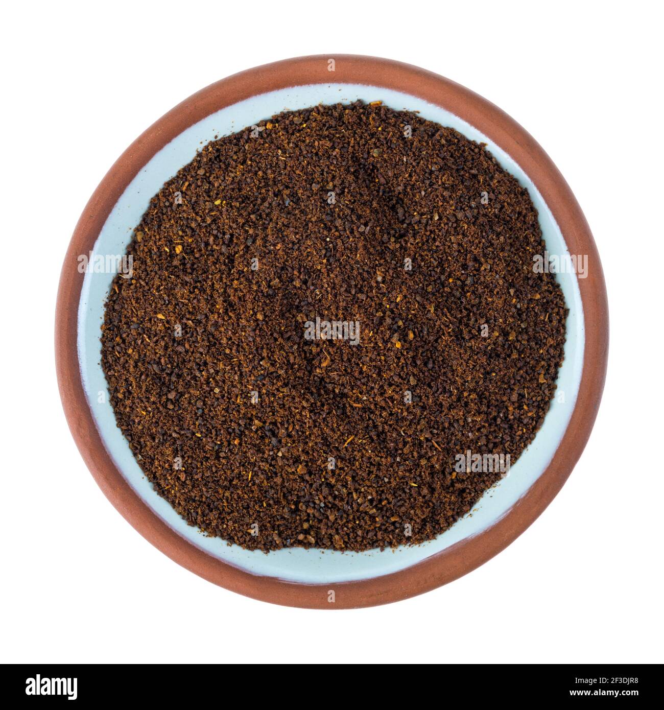 Chili powder in a small terracotta spice bowl Stock Photo - Alamy