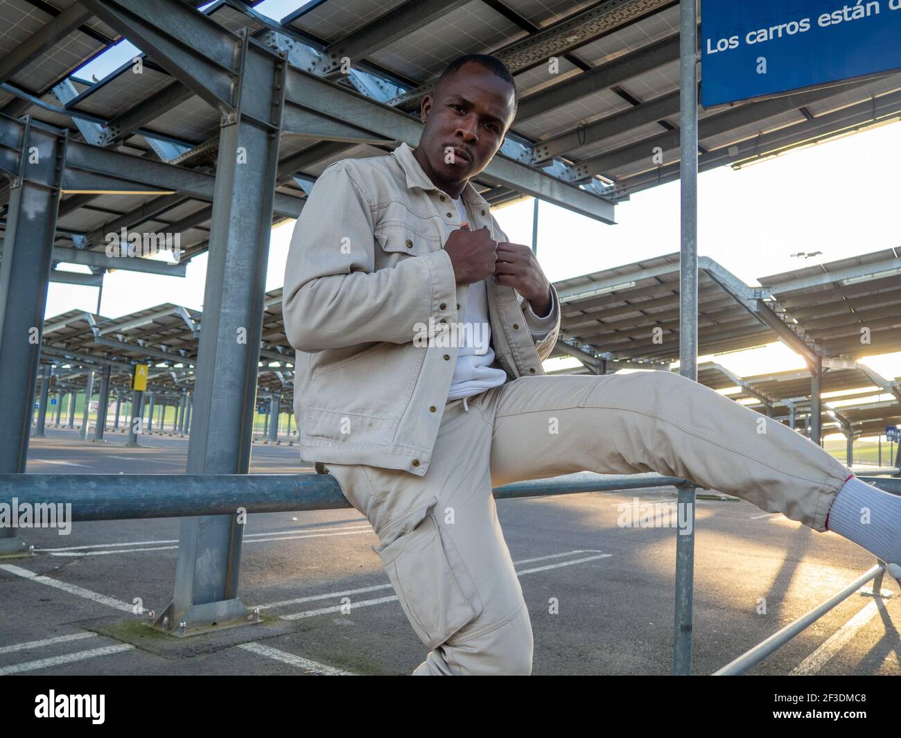 A handsome black Spanish male posing in the parking lot Stock Photo - Alamy