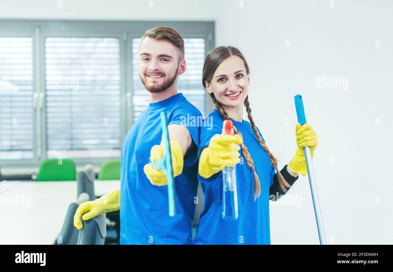 Woman and man in commercial cleaner team Stock Photo - Alamy
