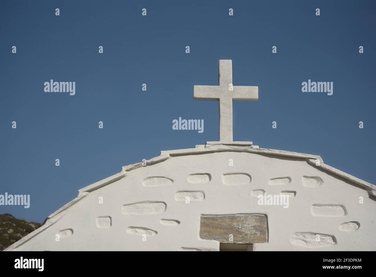 Traditional whitewashed Greek Orthodox chapel arched facade with a ...