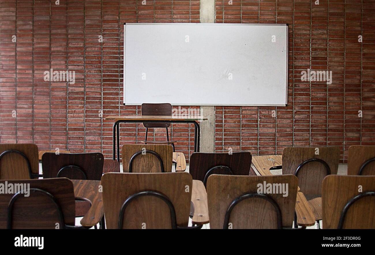 Empty Classroom Empty Teacher`s desk with Whiteboard in the background ...