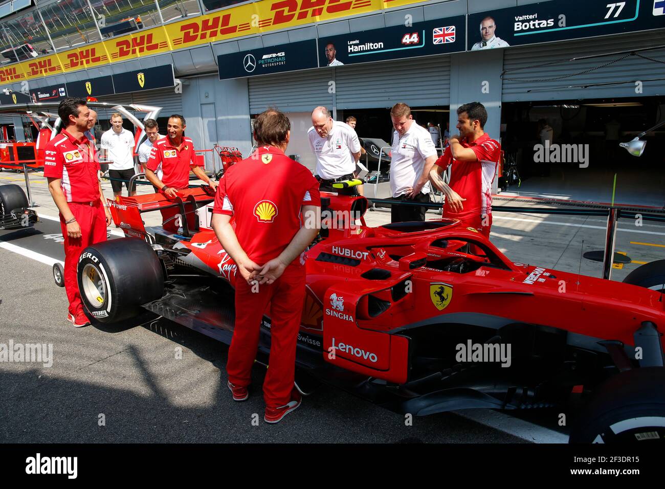 Mercedes AMG F1 engineers having a look at the Scuderia Ferrari SF71H ...