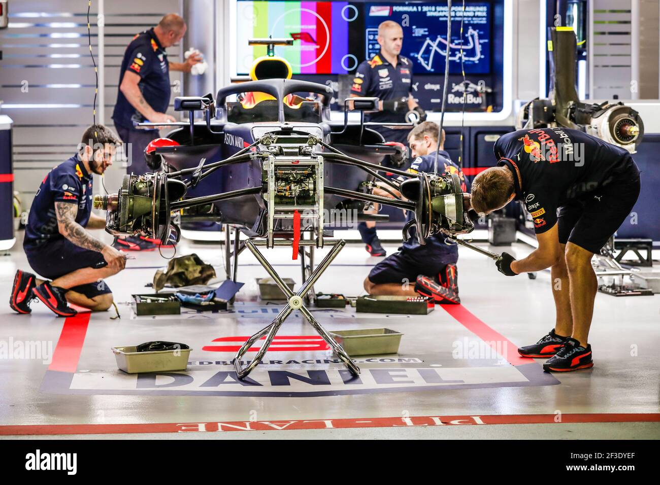 Mechanics working on the Aston Martin Red Bull Tag Heuer RB14 ...