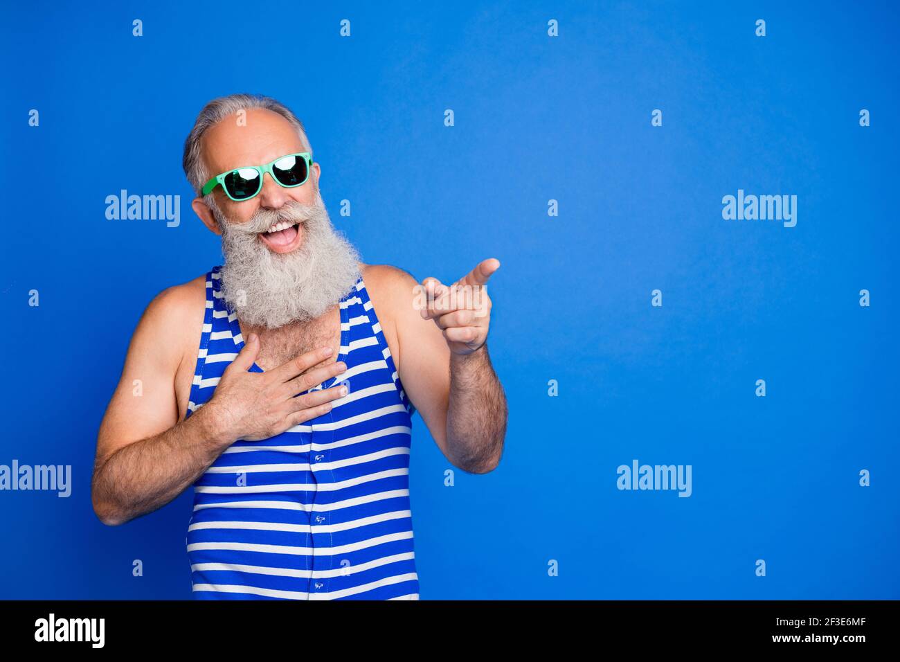 Photo of impressed grey beard man point empty space wear eyewear blue ...