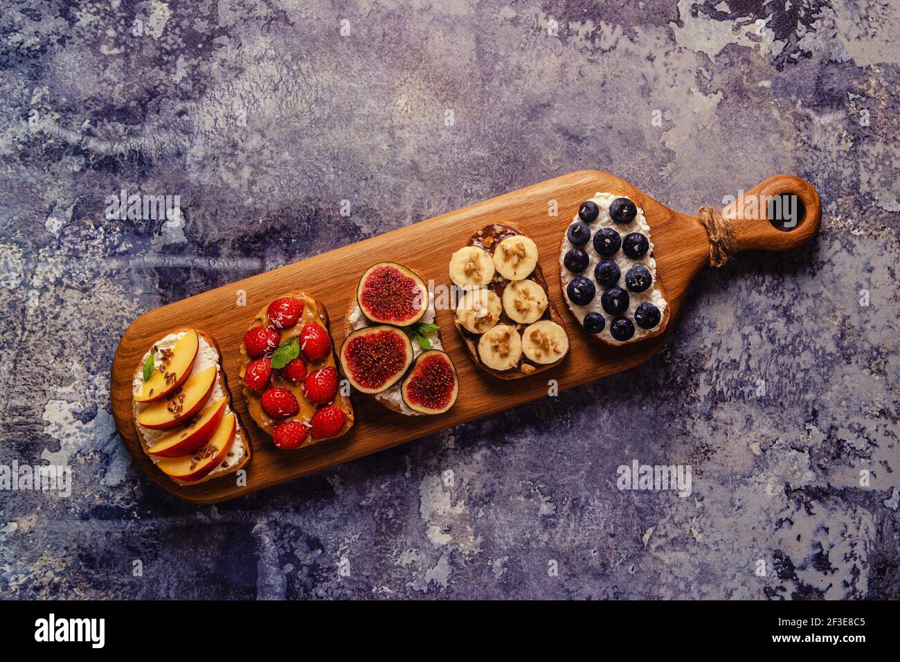 Homemade summer toast with cream cheese, nut butter and fruits and ...