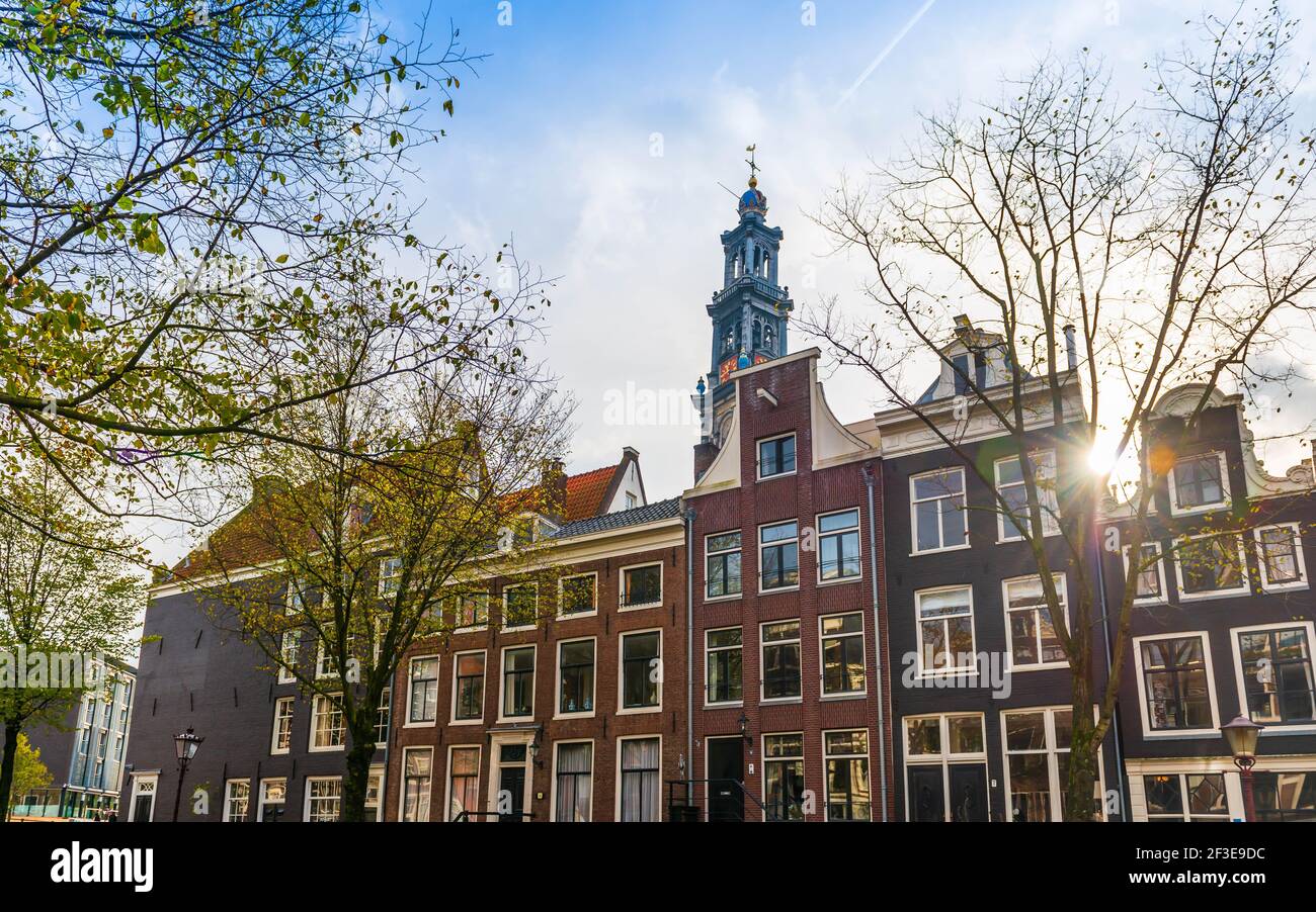 Typical facades of Amsterdam and in the background the church of ...