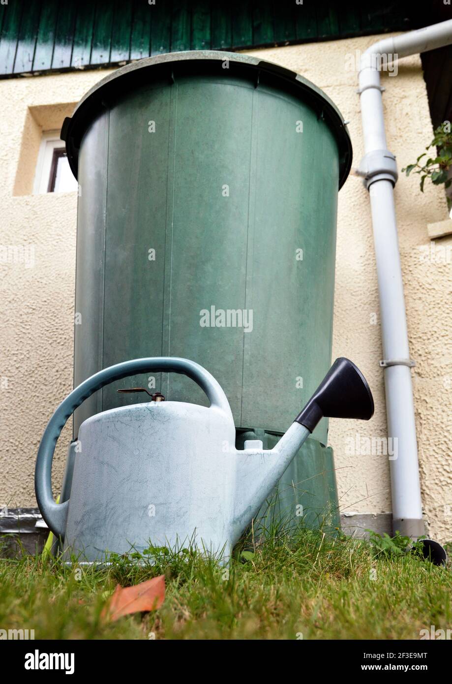 Ecological system for filling a watering can with rainwater from a ...