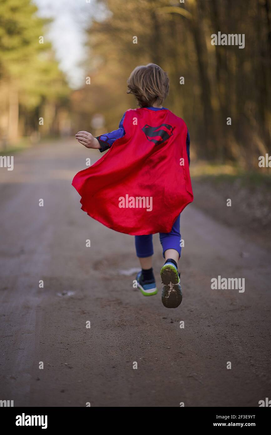 Child superhero costume running hi-res stock photography and images - Alamy