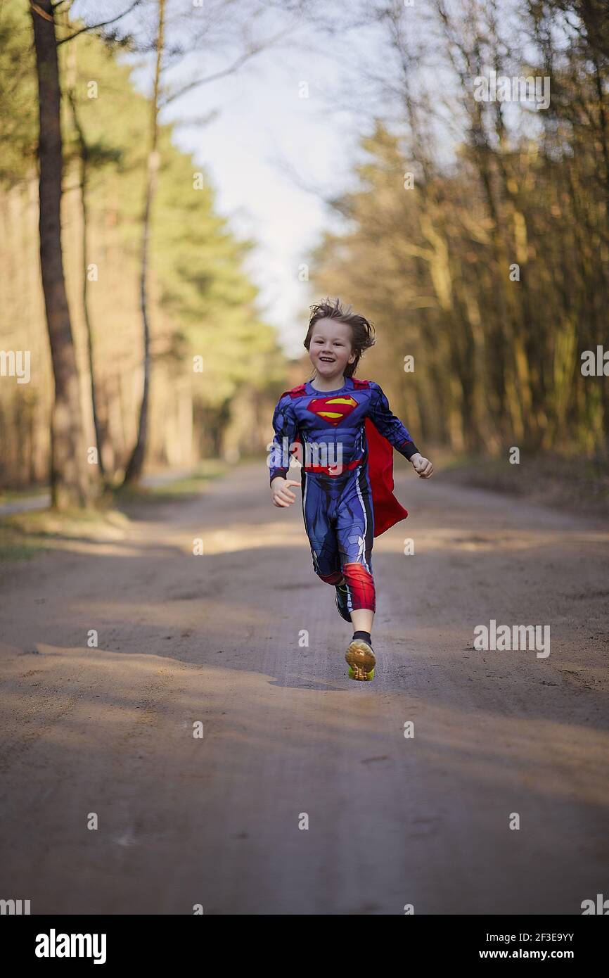 Child superhero costume running hi-res stock photography and images - Alamy
