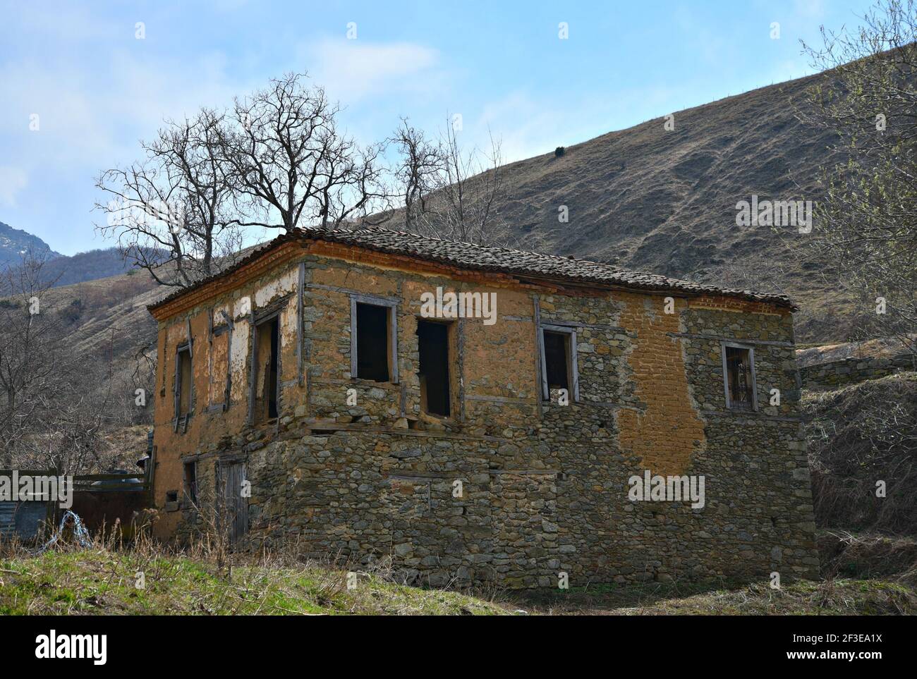 Old abandoned mud house with a traditional stone built facade in the ...