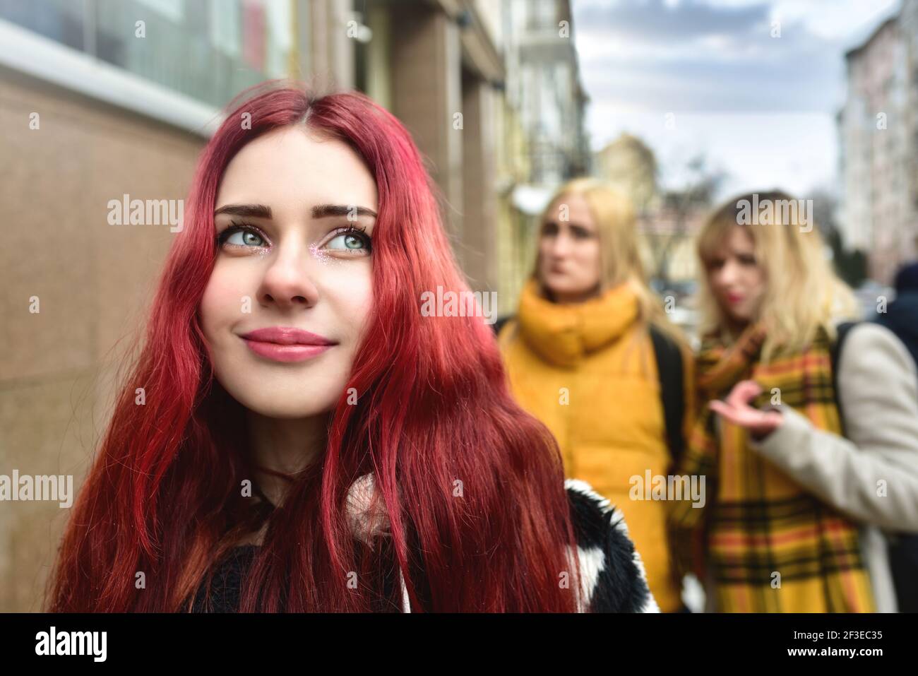 Self-confident teenage girl ignores jealous people who spread gossip ...