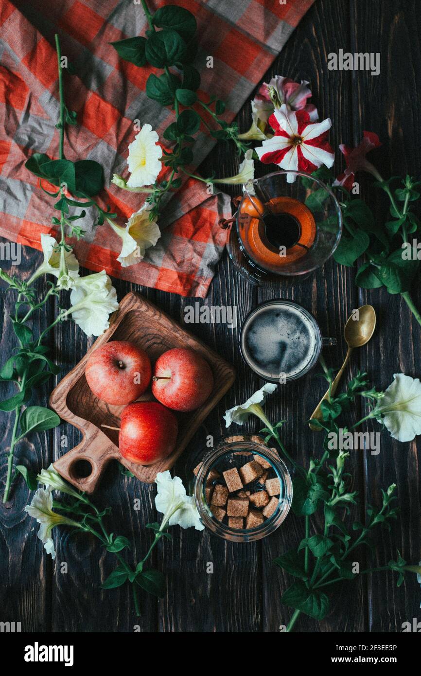 Dark photo of food. beautiful flat layout in rustic style with flowers ...