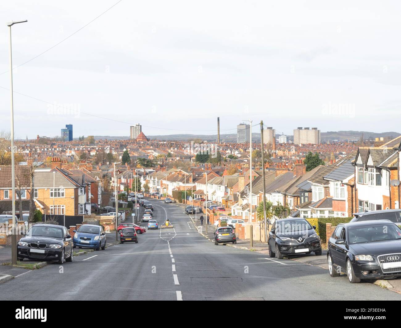 Steep road showing Leicester city centre, Highfields, tops of houses ...