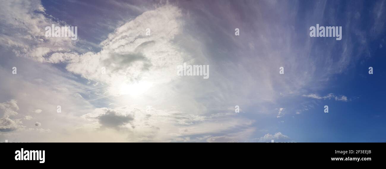 Spring sky with white clouds, blue skyline and sunsteam, nature ...