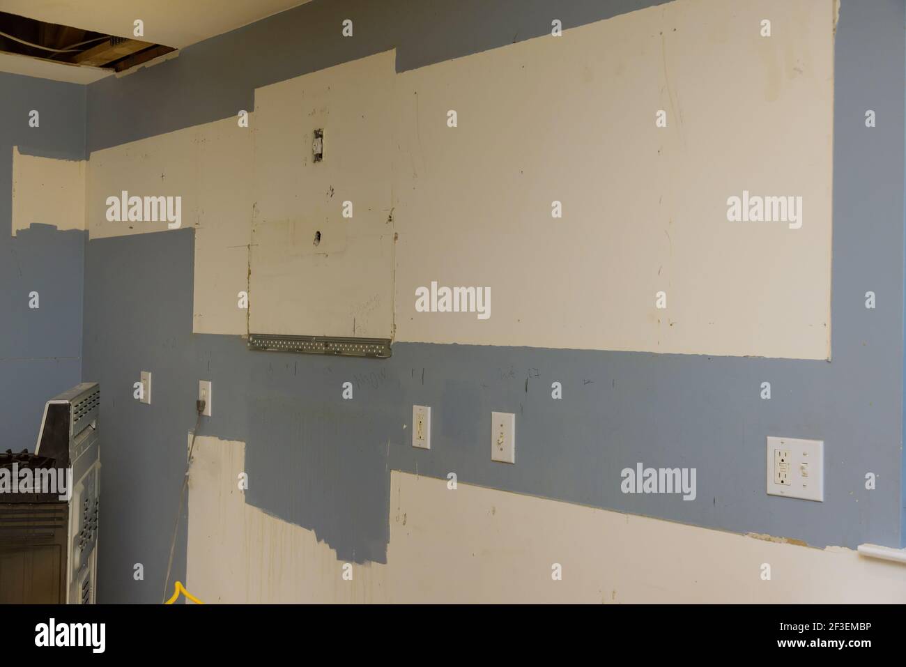 Home remodel repair the damage to plaster a wall Stock Photo - Alamy