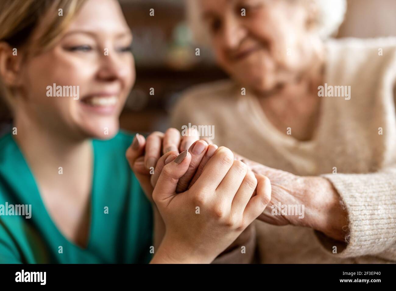 Helping hands care home dementia nurse hi-res stock photography and images - Alamy