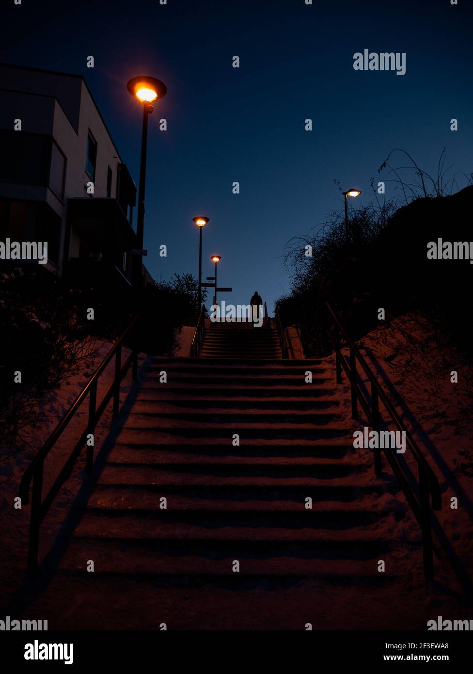 A vertical shot of a staircase during an evening hour Stock Photo - Alamy