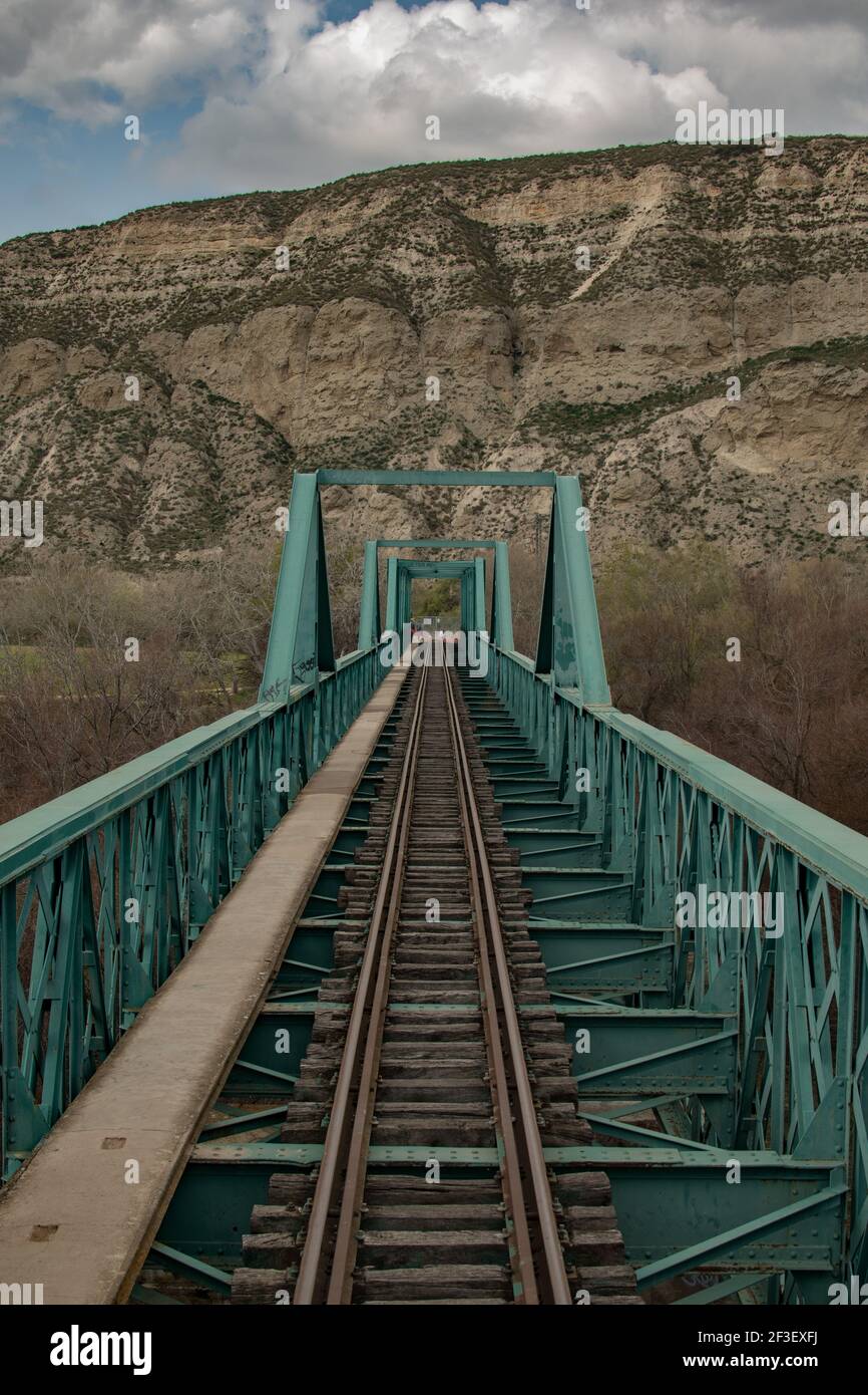A beautiful view of a railroad bridge among mountains Stock Photo - Alamy