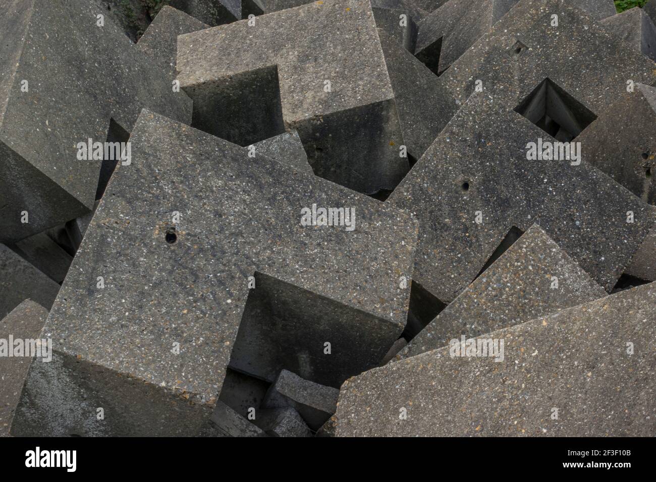 Sea defence blocks placed to stop erosion on the beach at Grain Kent ...